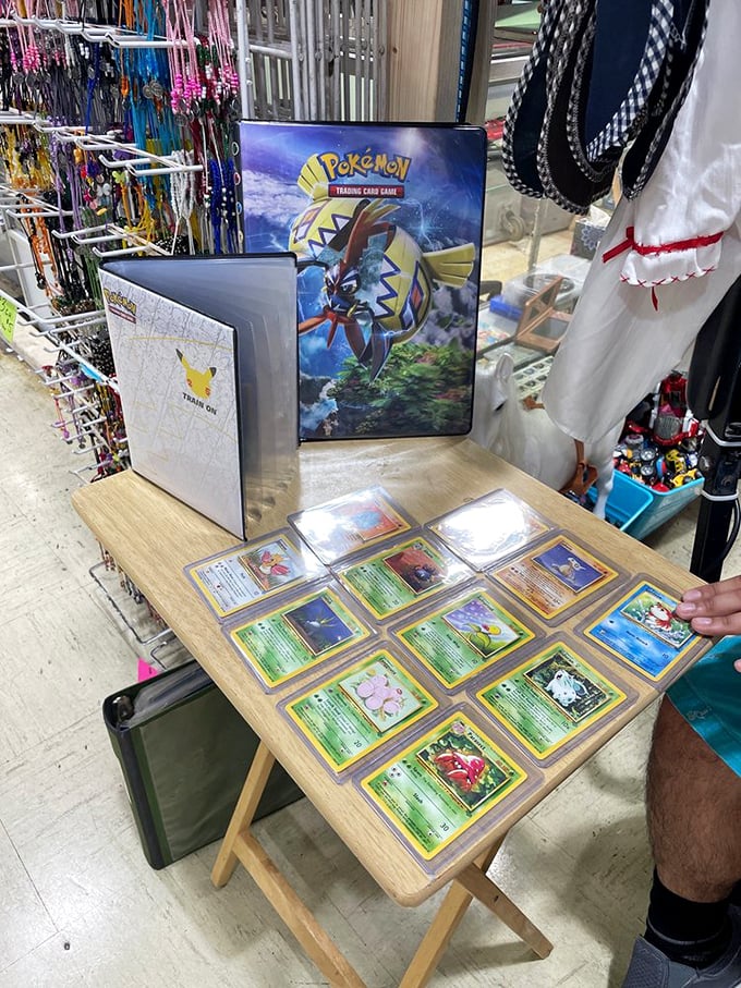Pokémon cards laid out like rare artifacts in a museum of childhood nostalgia. The serious expressions of collectors reveal this is no child's play.