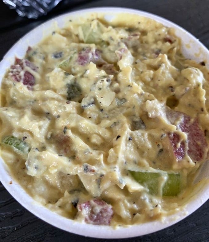 Potato salad that doesn't try to reinvent the wheel, just polishes it to perfection – creamy, substantial, and ready to complement whatever meat you choose.