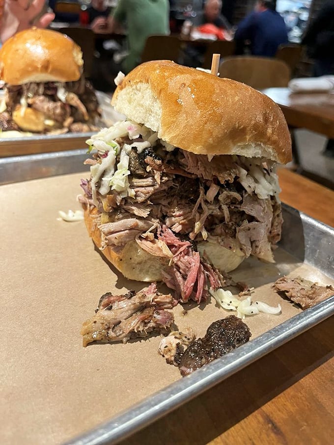 This sandwich isn't just overstuffed—it's living its best life. The pulled pork practically cascades down the sides like a meaty waterfall.