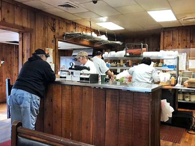 Behind the counter, sandwich artists work their magic with the precision of surgeons and the speed of pit crews.