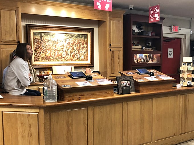 The front counter—where first-timers become regulars and regulars become evangelists for the gospel of Southern cooking.