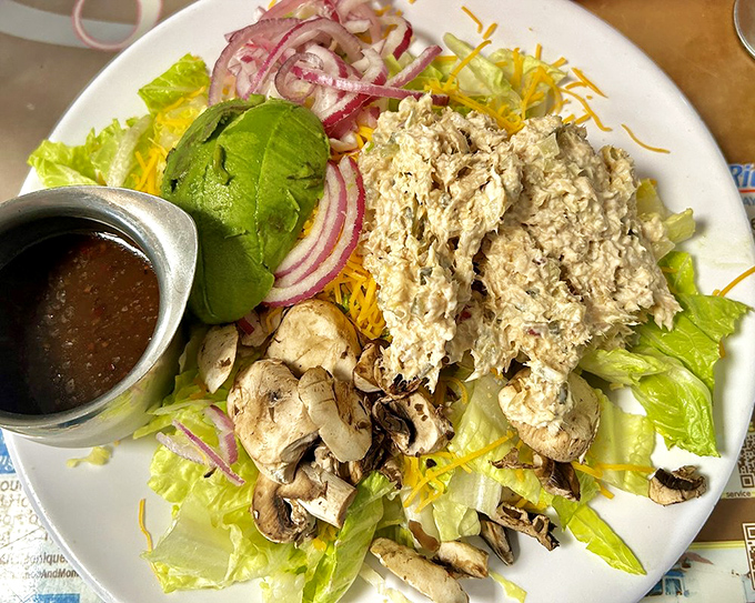 Even the salads at Sax's come with a side of generosity—fresh ingredients piled high enough to make you momentarily forget about those cinnamon rolls.