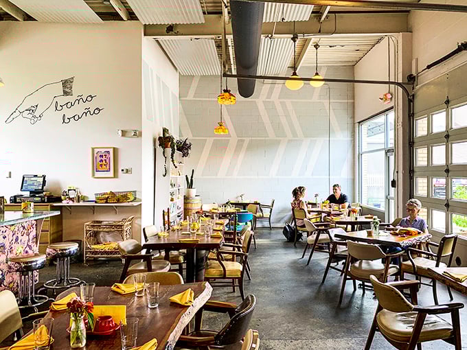 Mid-century chairs and wooden tables create a dining room that feels like the coolest friend's house—if that friend happened to be a culinary genius.