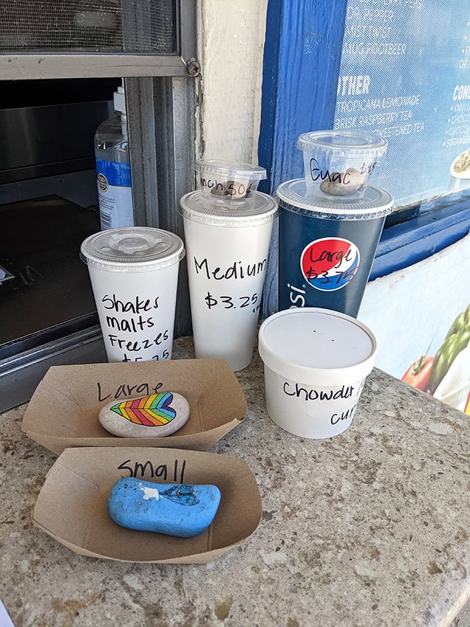 Size matters at The Spot. These cups and containers aren't just serving vessels—they're promises of satisfaction to come.