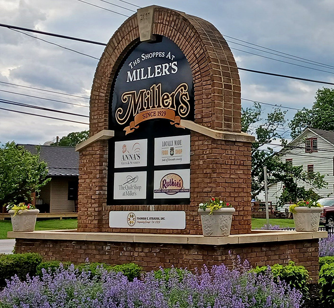The sign announces Miller's presence like a town crier for good eating. Those lavender plantings aren't just pretty—they're setting the stage for sensory delight.