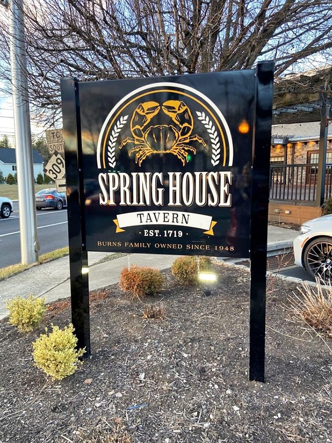 The tavern's sign proudly displays its crab logo – a nod to the seafood excellence you'll find inside this Pennsylvania landmark.