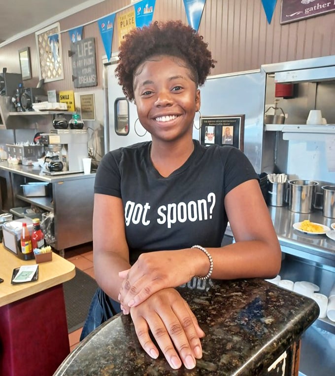 A staff member's smile says it all – "got spoon?" isn't just a cute slogan, it's a legitimate question for the uninitiated.