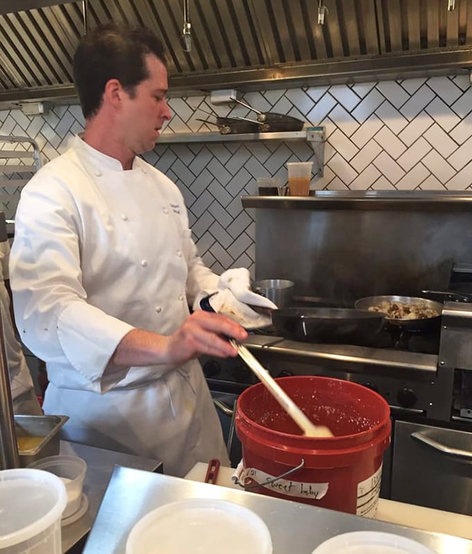 In the kitchen, precision meets passion – the chef's whites a canvas for the morning's culinary performance.