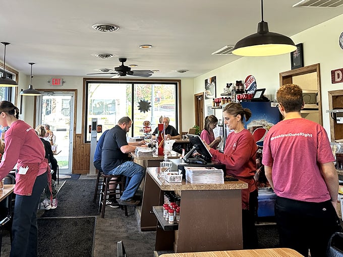 The choreography of a busy diner kitchen – where staff in matching shirts move with the practiced precision of a small-town ballet.