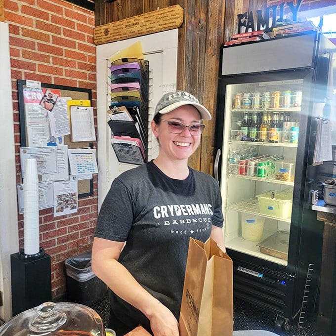Behind that smile is someone who knows exactly how many minutes that brisket needs—not a second more or less.