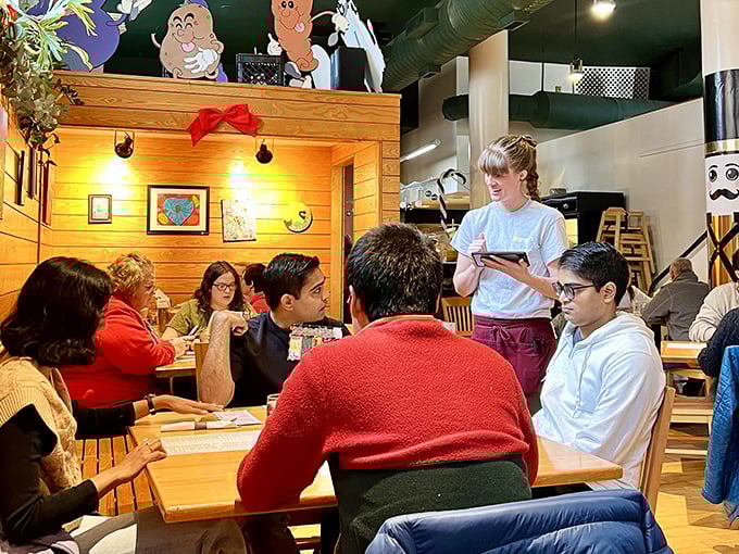 The staff moves with practiced efficiency, taking orders with the confidence that comes from knowing every item on that encyclopedic menu.