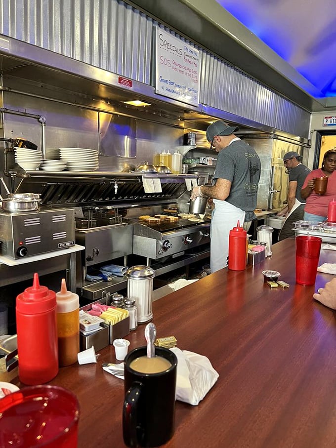 The kitchen ballet in full swing—where short-order magic happens at the hands of cooks who know exactly what you need before you do.