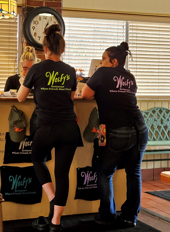 The backs of Wolfy's servers tell a story of hustle, hospitality, and the kind of service that remembers how you take your coffee.