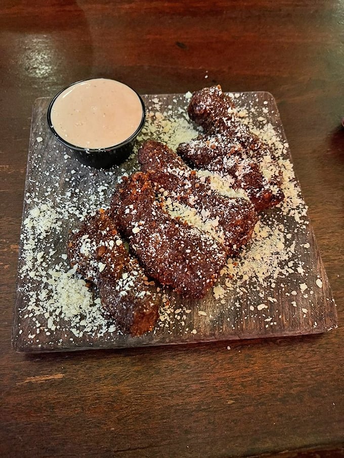 Chocolate decadence dusted with powdered sugar—dessert that would make even the toughest gunslinger put down his weapons and pick up a fork.