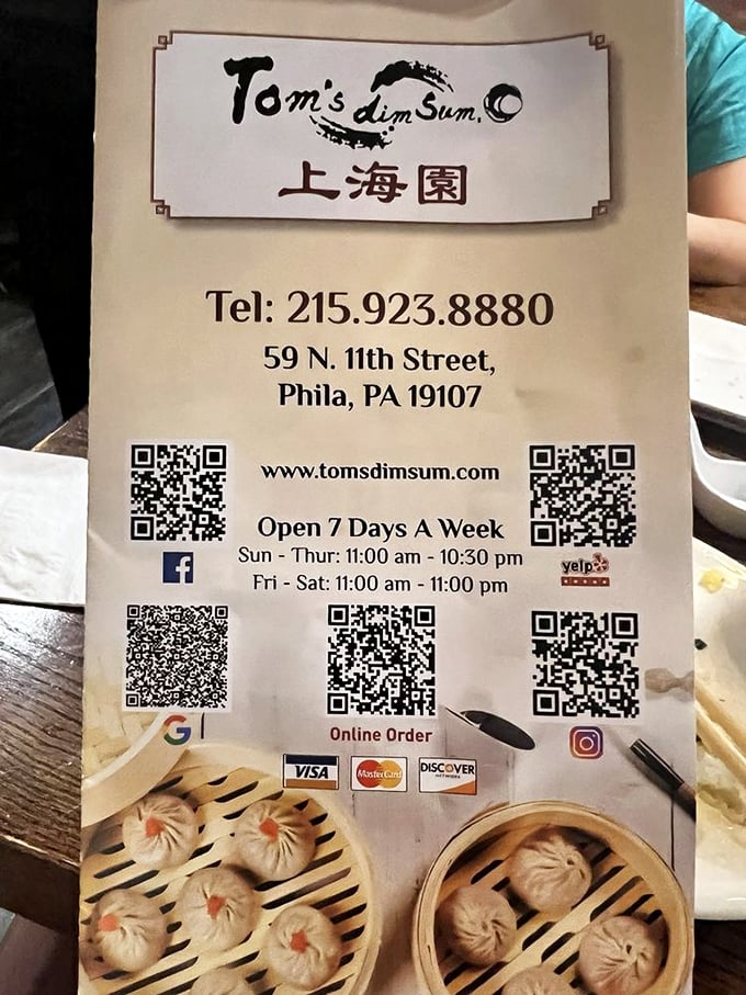 The business card reveals all you need to know—including that they're open seven days a week, because dumpling cravings don't observe weekends.