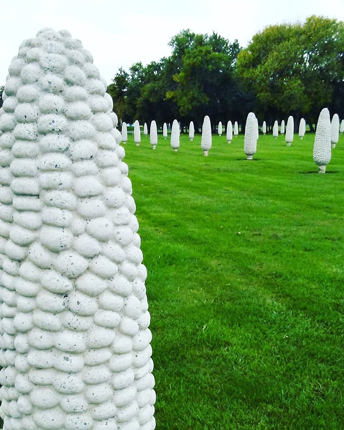 Up close, you can appreciate the detailed craftsmanship of each kernel—someone really put their heart and soul into these concrete vegetables.