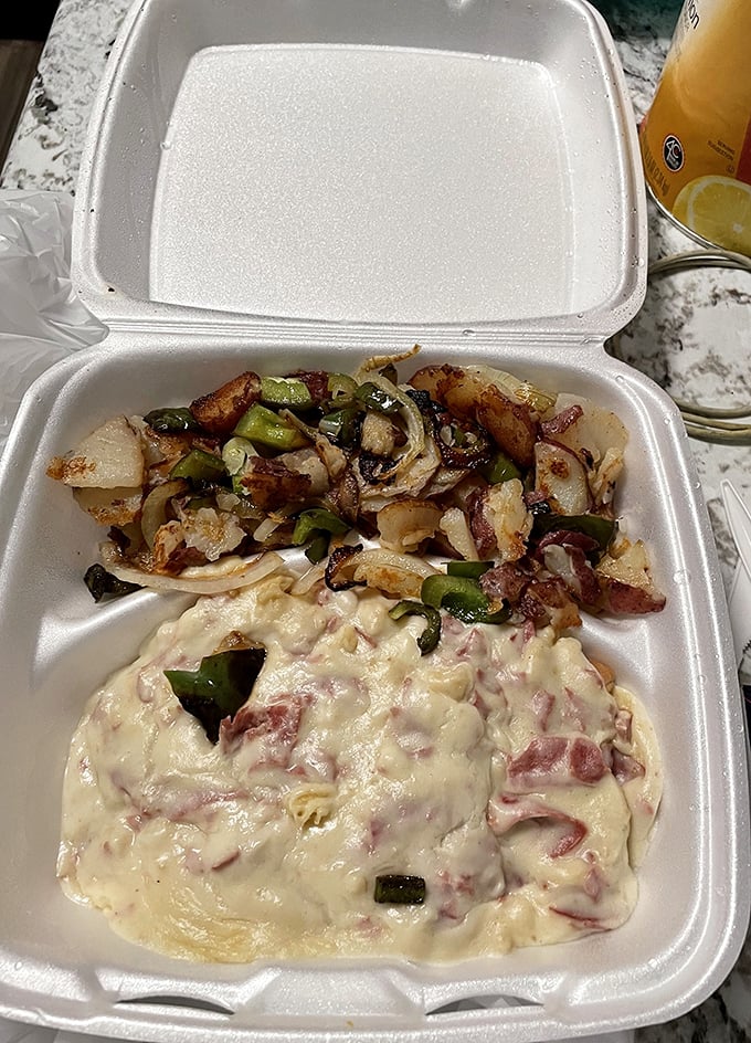 Takeout that travels well – proof that good things come in styrofoam packages when they're filled with home fries and cheesy eggs.