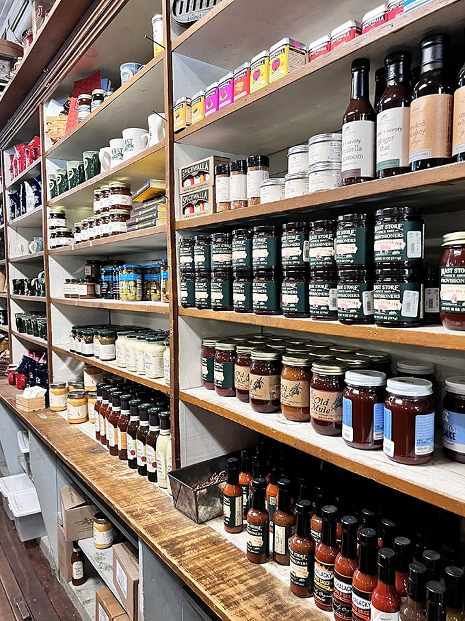 These shelves don't just hold jams and jellies—they showcase liquid sunshine in jars, each one containing summer's sweetness waiting for winter toast.