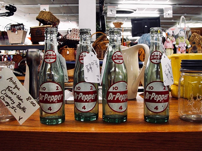 Vintage Dr Pepper bottles stand at attention, a fizzy time capsule from when soda came in glass and "10-2-4" was the schedule for refreshment breaks.