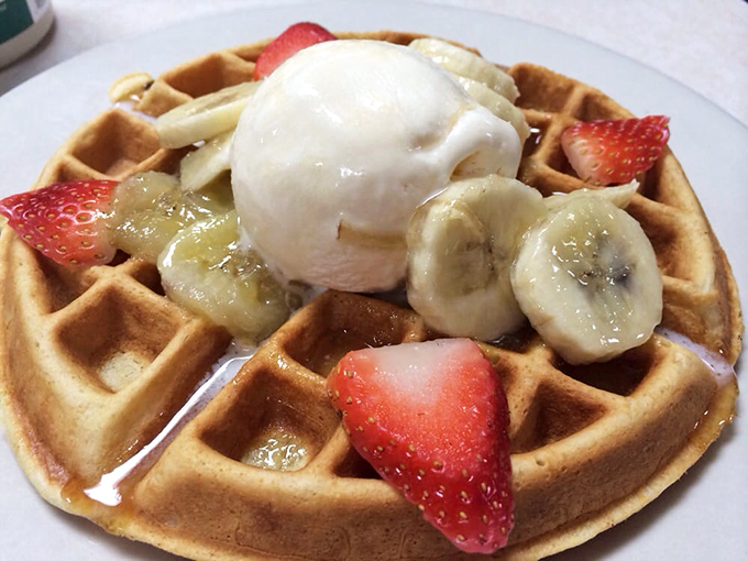 A waffle that's dressed for success with fresh berries, bananas, and ice cream. Breakfast or dessert? The delicious dilemma we all deserve.