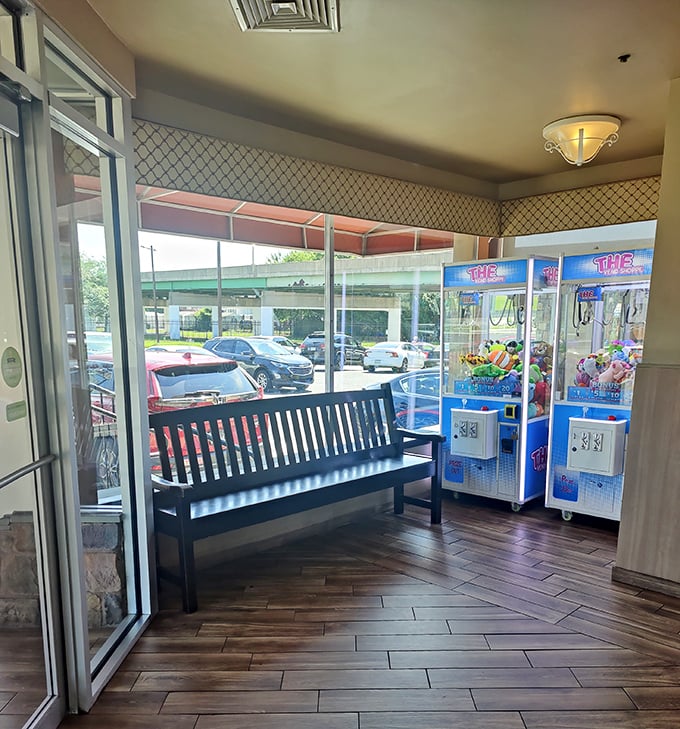 The anticipation chamber. Even the waiting area with its bench and claw machines feels like part of the Penrose experience—worth every minute.