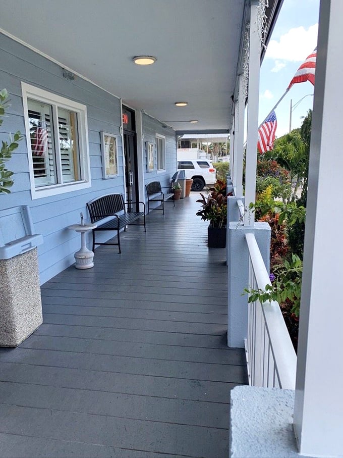 The front porch waiting area—where anticipation builds and breakfast appetites sharpen. That American flag adds a touch of patriotic pancake pride.
