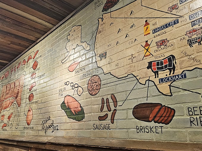 This wall isn't just decoration—it's a barbecue geography lesson and meat manifesto all in one colorful display.