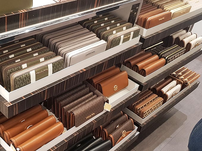 Michael Kors wallet wonderland, where your credit card can die a noble death while purchasing a new home for itself.