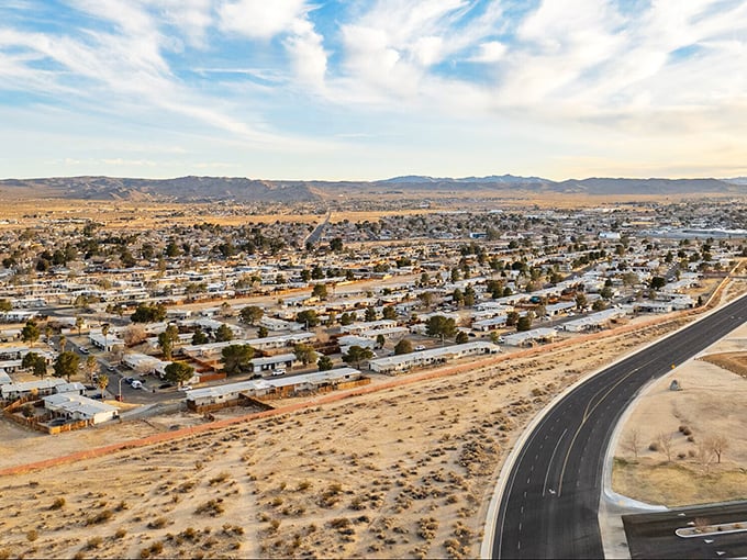 Ridgecrest's main drag stretches toward mountains that seem painted onto that impossibly blue desert sky—retirement with breathing room!
