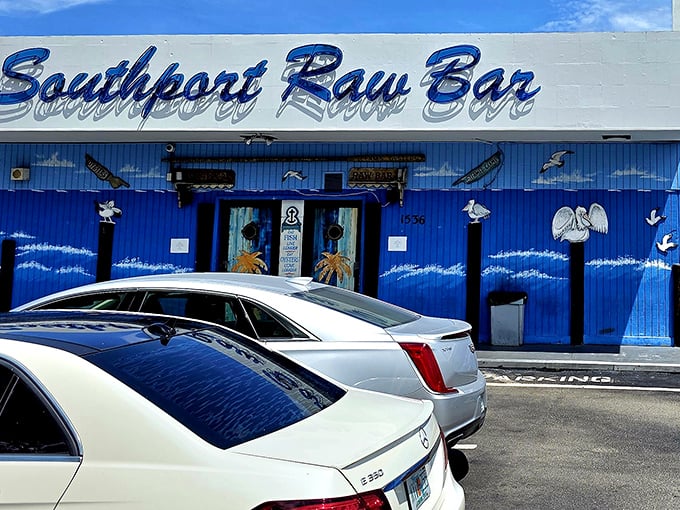 Southport's blue facade has weathered more Florida storms than a weather reporter – and still serves seafood that makes locals swoon.