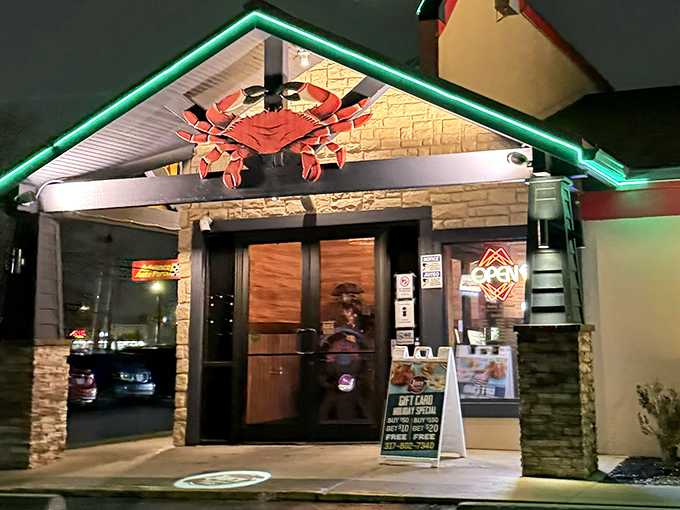 The Juicy Seafood's entrance glows with neon promise – like Vegas for seafood lovers.