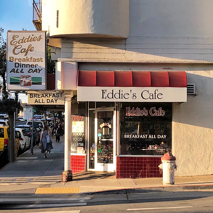 That classic red awning signals something special – where locals gather for pancakes and genuine conversation.