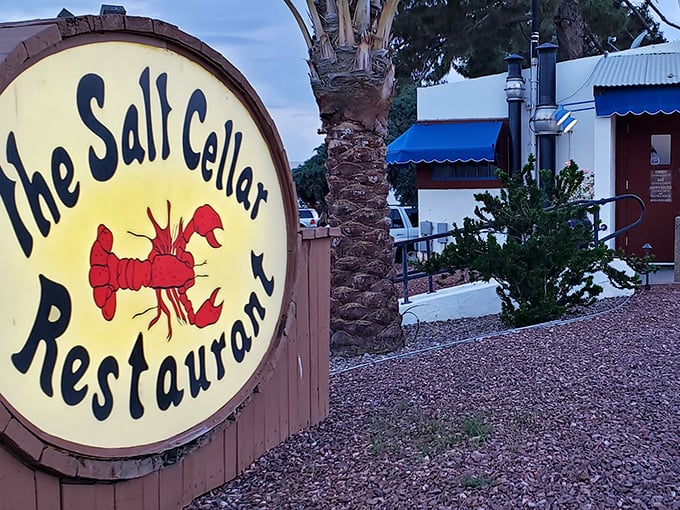That cheerful red lobster practically winks at you, hinting at the subterranean seafood magic below.