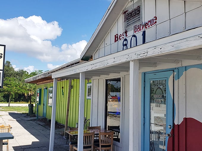 Simple white building, blue door, and "801" address—remember these details for your barbecue treasure map.