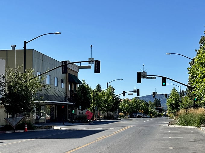 Traffic lights strung like beads on Ukiah's main artery! Modern convenience meets mountain majesty in this perfectly balanced blend of progress and natural beauty.