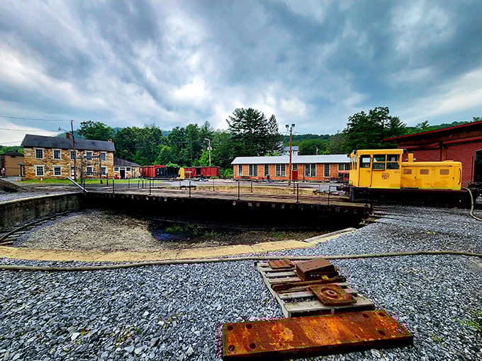 The railroad's mechanical heart—the turntable—where massive locomotives pirouette with surprising grace despite their iron bulk.