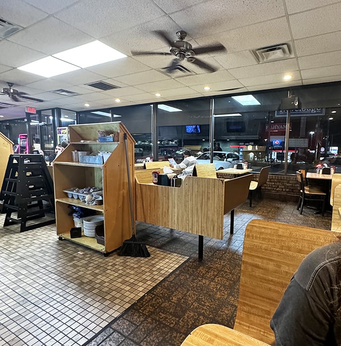 The late-night diner atmosphere captured perfectly—tile floors, booth dividers, and that distinct feeling that good food is coming your way. Midnight philosophers have solved world problems in places just like this.