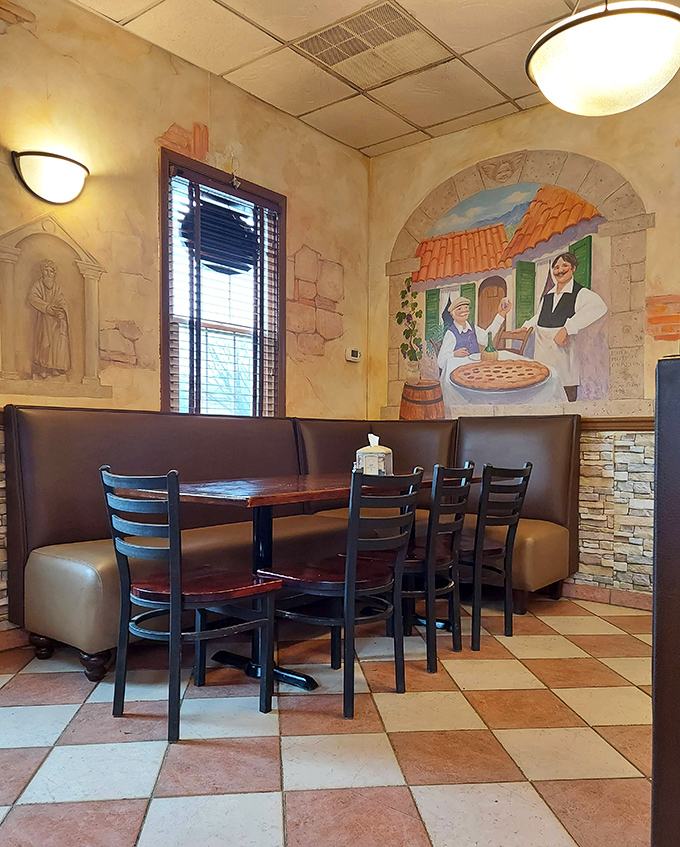 Murals depicting Italian countryside scenes add Old World charm without feeling like you're trapped in a theme park restaurant.