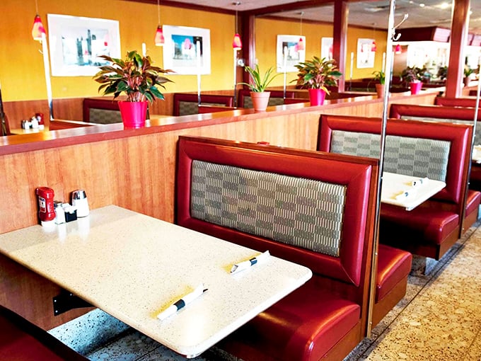 Booth seating with warm wood paneling creates the perfect environment for solving the world's problems over plates of eggs and hash browns.