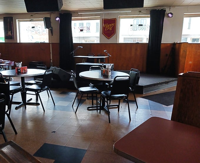 Simple tables waiting for hungry patrons – each one a blank canvas for the hot dog artistry about to unfold.