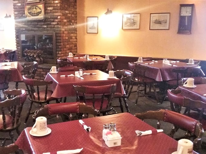 Red tablecloths and wooden chairs create that timeless diner atmosphere where conversations flow as freely as the coffee refills.