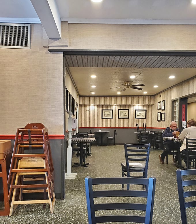 The dining room's quiet corner offers refuge for those seeking conversation alongside their comfort food.