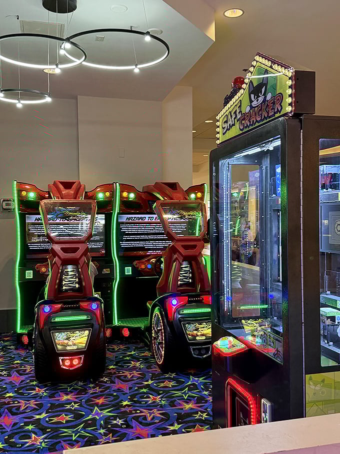 The arcade—where parents' shopping stamina gets a second wind while kids burn energy on racing games. Everybody wins.
