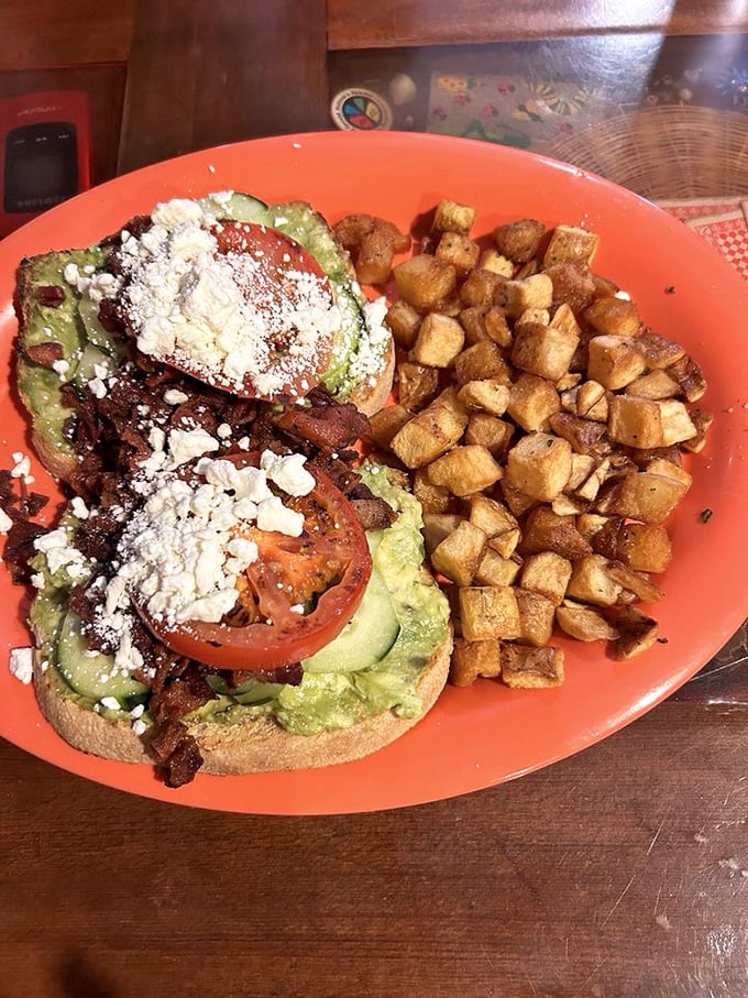 Avocado toast that Instagram dreams are made of—a masterclass in layering textures and flavors that would make any millennial weep with joy.