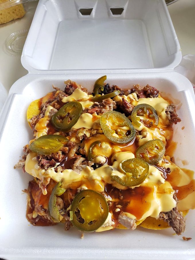 BBQ nachos topped with jalapeños for those who like their indulgence with a kick. A beautiful mess that's worth every napkin.