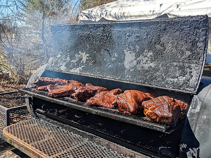 The holy grail of barbecue – a proper smoker doing its low-and-slow magic. This isn't cooking; it's meat alchemy happening before your eyes.