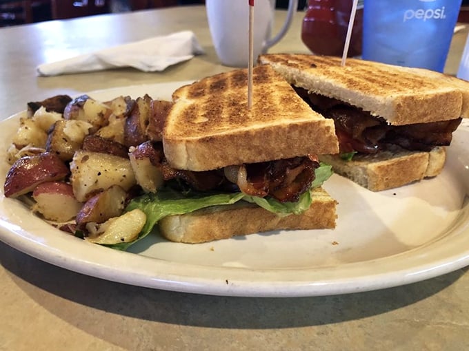 The BLT—where three simple letters translate to "Better Lunch Today" and those home fries are having their own little flavor party.