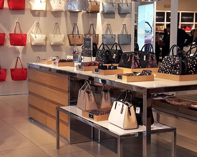 Handbag heaven—where purses of every hue stand at attention, silently judging your current worn-out tote while whispering, "Take me home."