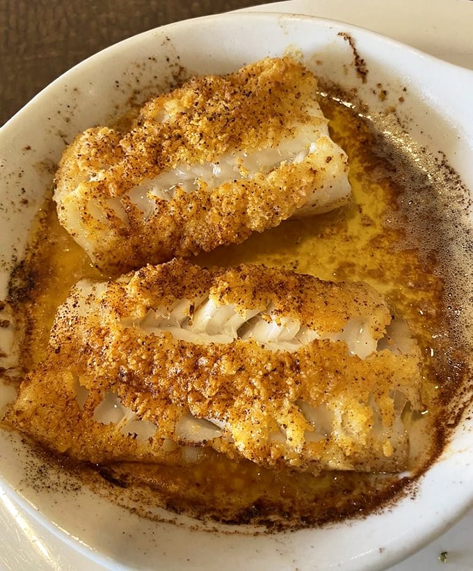 This baked cod, dusted with seasoning and swimming in butter, isn't just dinner—it's proof that Pennsylvania knows its way around seafood.