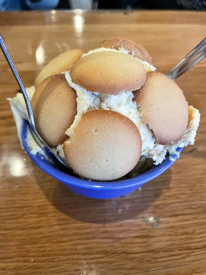 Banana pudding with vanilla wafers standing at attention—the kind of dessert that makes you wonder why you ever waste calories on anything else.